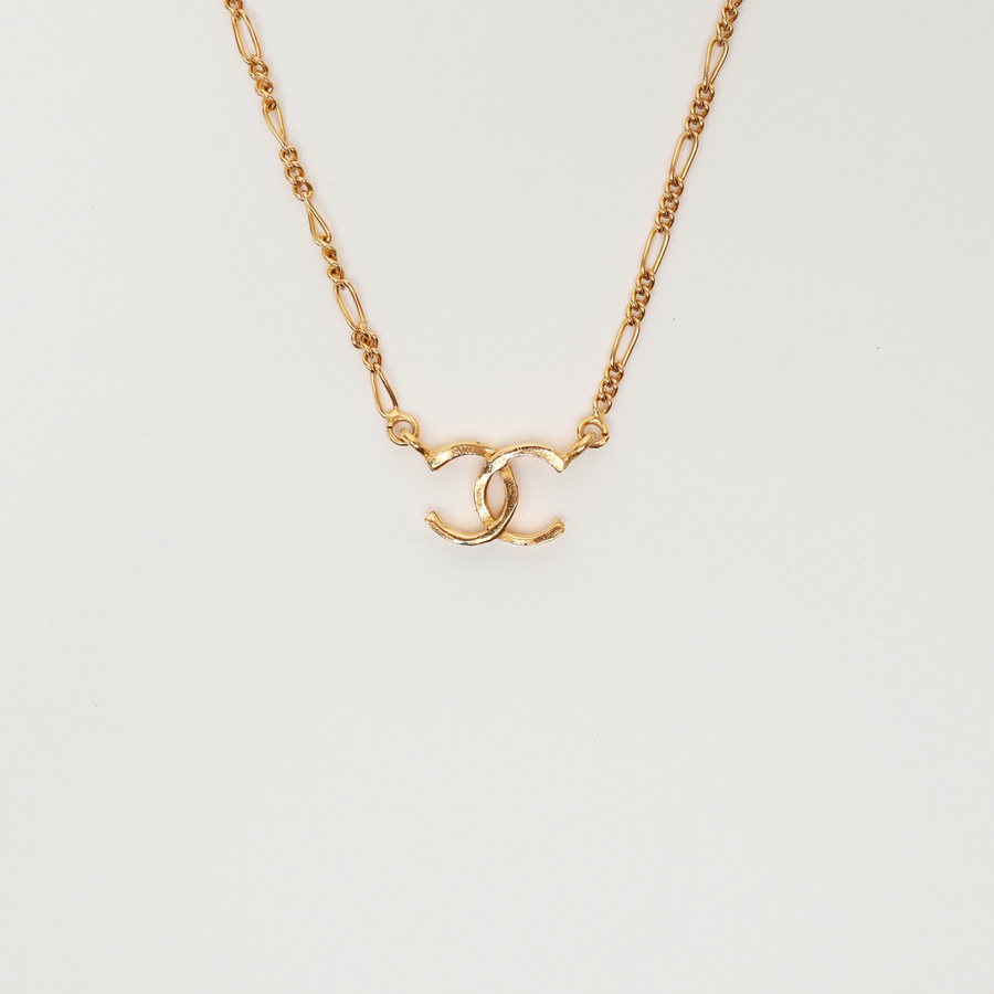 Vintage CHANEL Coco Mark Twist Necklace - A Retro Tale