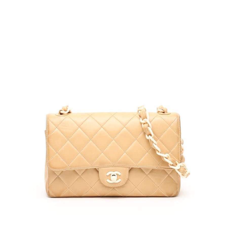 Vintage Chanel Classic Medium Plastic Chain Single Flap Bag - A Retro Tale