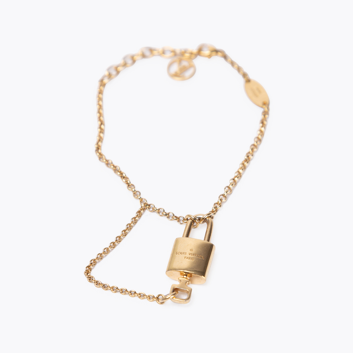 LOUIS VUITTON Gold Lock Bracelet - A Retro Tale